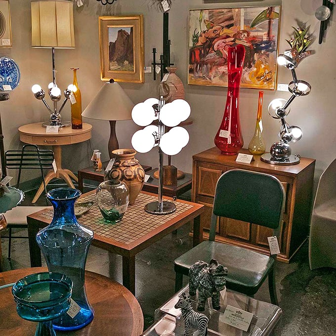 Mid-century modern meets contemporary cool in this vignette where colorful glass and sculptural lamps create a retro futuristic conversation starter.