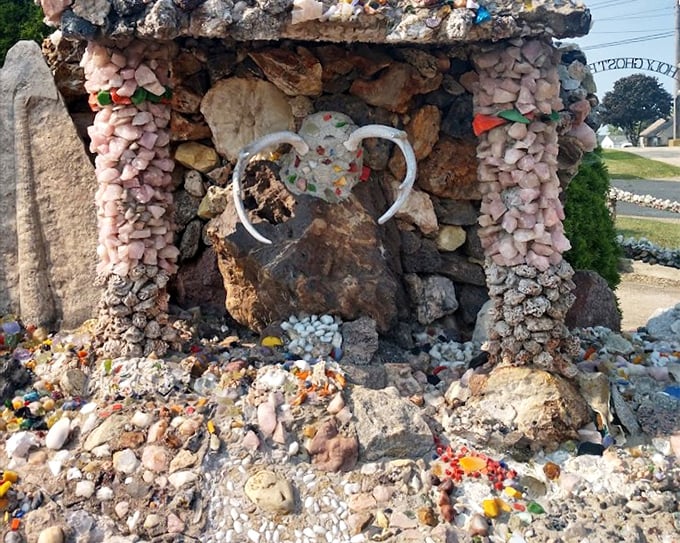 Nature meets artistry in this detailed rockwork—like someone gave the earth's crust a makeover with found objects and infinite patience.
