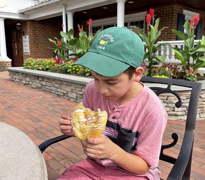 A young customer contemplates life's important questions, like "Can I eat this whole pretzel?" Spoiler alert: absolutely yes.