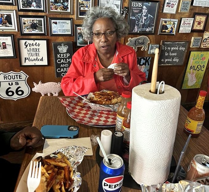 The dining room feels like your coolest friend's basement—if that friend happened to be a barbecue savant with excellent taste in memorabilia.
