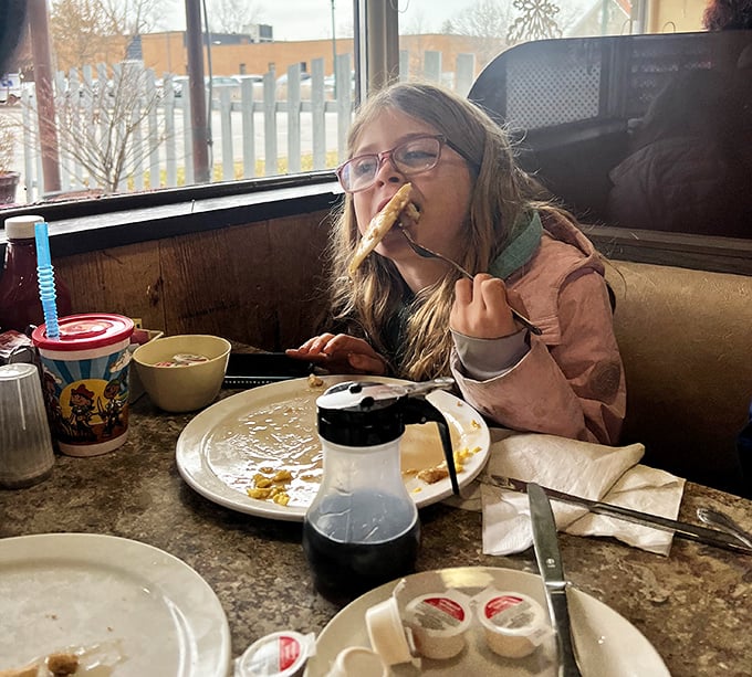 The joy of childhood pancakes captured perfectly—where breakfast becomes an adventure and maple syrup is liquid gold.