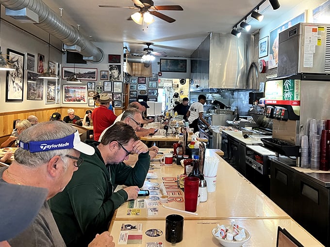 The counter crew—Columbus's breakfast philosophers solving the world's problems over coffee and eggs while the grill sizzles with possibilities.
