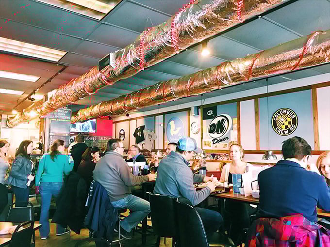 The symphony of breakfast in full swing—clattering plates, murmured conversations, and the collective joy of people who understand that calories don't count before 11 AM. 