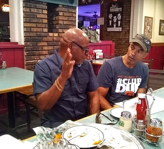 Where serious food conversations happen – these gentlemen know that the best debates are fueled by excellent pizza and perhaps a burger or two.