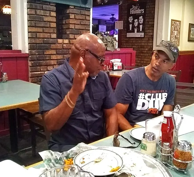 Where serious food conversations happen – these gentlemen know that the best debates are fueled by excellent pizza and perhaps a burger or two.
