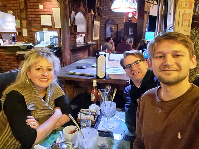 The true measure of a restaurant isn't just the food—it's the memories being made at tables like this one, where conversations flow as freely as the drinks.