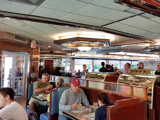 The dining room hums with the beautiful symphony of forks against plates and genuine conversation. This is community in its purest form.