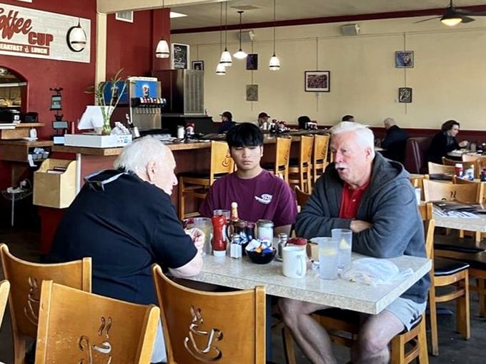 Regulars solving world problems over endless refills – democracy in action, one cup at a time.