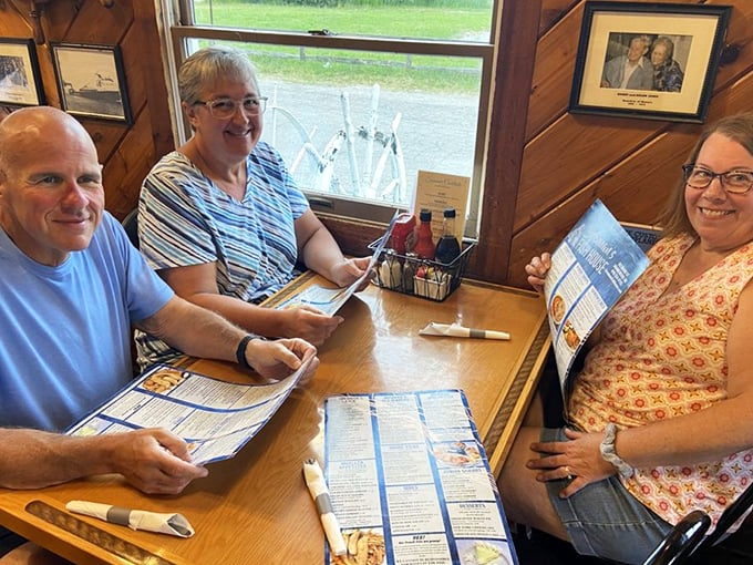Happy diners sharing stories and seafood—the universal language of good eating that brings together friends, family, and strangers who soon become friends over a great meal.