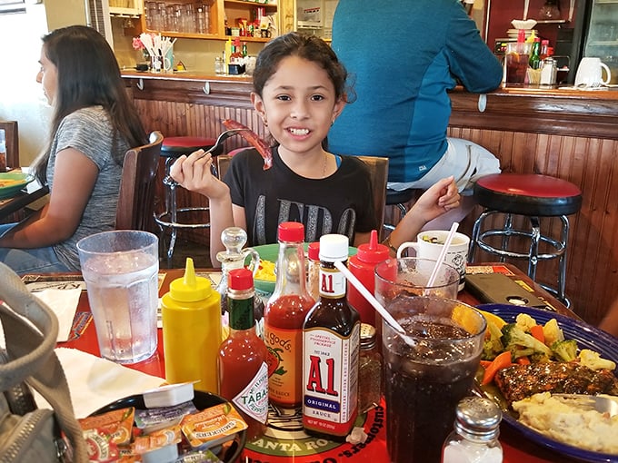 Family-friendly in every sense, where condiment collections rival toy stores and smiles come standard with every order.