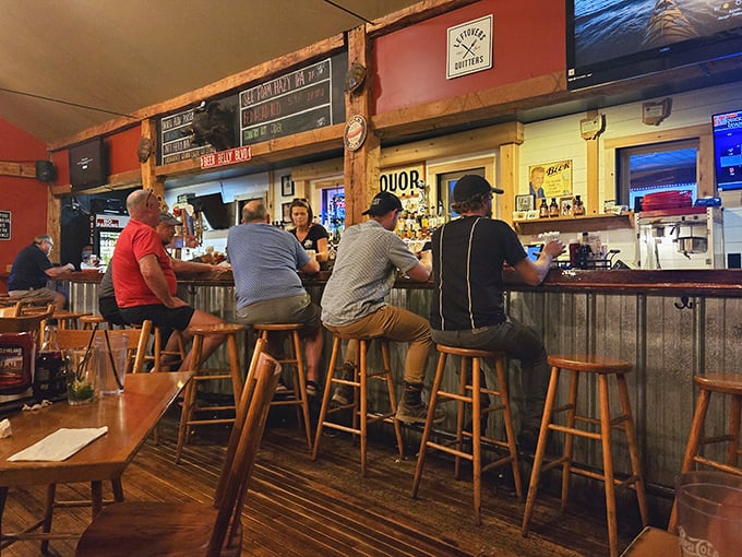 The bar at Lager Heads—where strangers become friends over pints and plates. That corrugated metal front has heard countless "mmms" of approval.