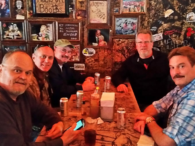 The true measure of any dive bar is the cross-section of humanity it attracts—from cowboys to office workers, all united by great burgers and cold beer.