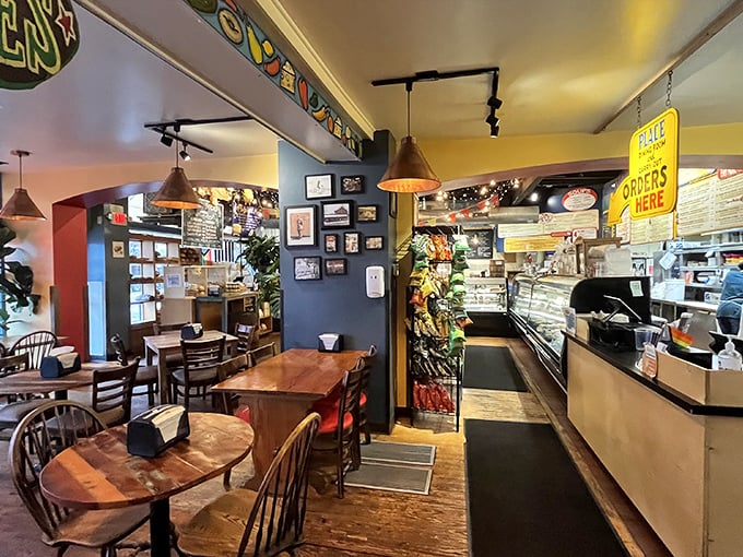 The counter service area buzzes with anticipation as hungry patrons eye both the menu and the treasures behind glass display cases.