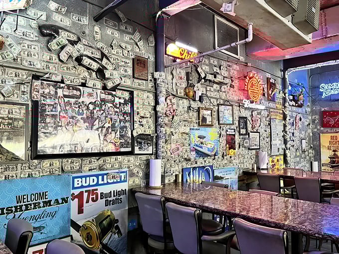 Money literally lines the walls where seafood lovers gather. The décor wasn't planned by a designer but curated by thousands of satisfied customers over countless meals.