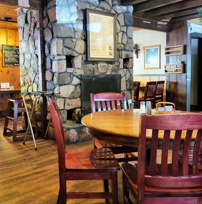 Stone fireplace meets wooden charm – where breakfast conversations linger and nobody's checking their watch. Time slows down here.