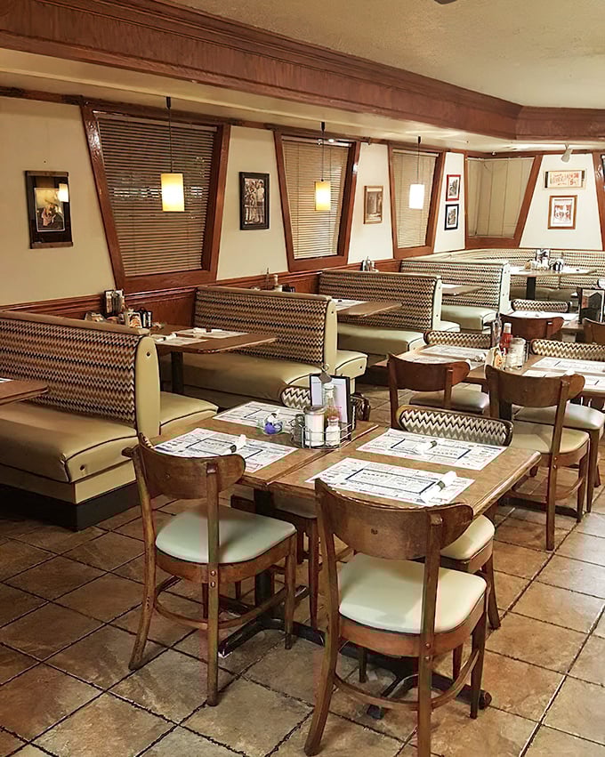 Cozy booths with chevron upholstery invite you to settle in for a leisurely meal. The wooden chairs and tables speak of durability and tradition.