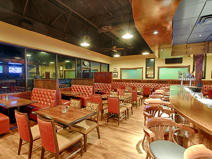 The dining area balances upscale ambiance with comfortable approachability—red leather booths invite you to settle in for the long haul because rushing through a meal here would be culinary sacrilege.