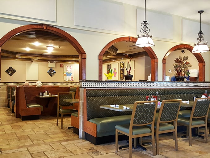 Arched dividers and comfortable booths create dining "neighborhoods" within the spacious interior. Privacy with a side of people-watching.