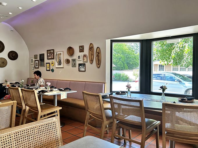 "Woven chairs, natural light, and walls adorned with traditional baskets create a dining room that feels both gallery-worthy and comfortably familiar."