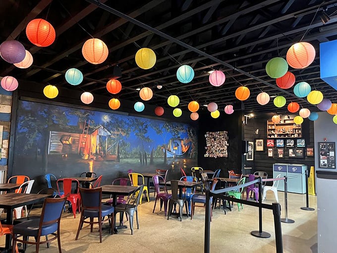 The dining room feels like a carnival crossed with a smokehouse, where colorful lanterns dance overhead while serious eating happens below.