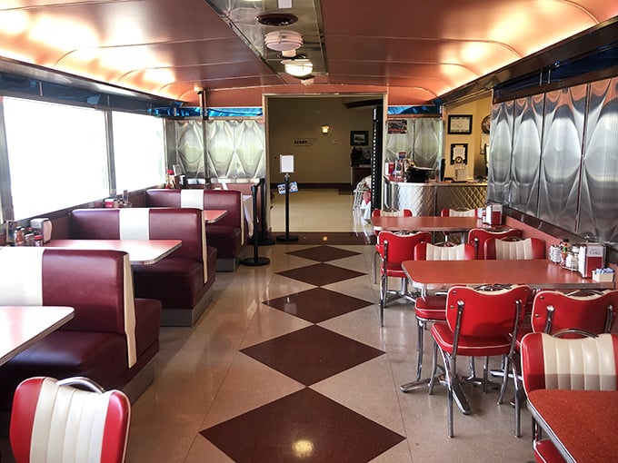 The classic diner interior features that unmistakable checkerboard floor—where every step feels like you're walking through an episode of Happy Days.
