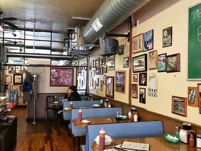 Blue booth seating and walls covered in memories—the classic diner formula that's outlasted every food trend for good reason.