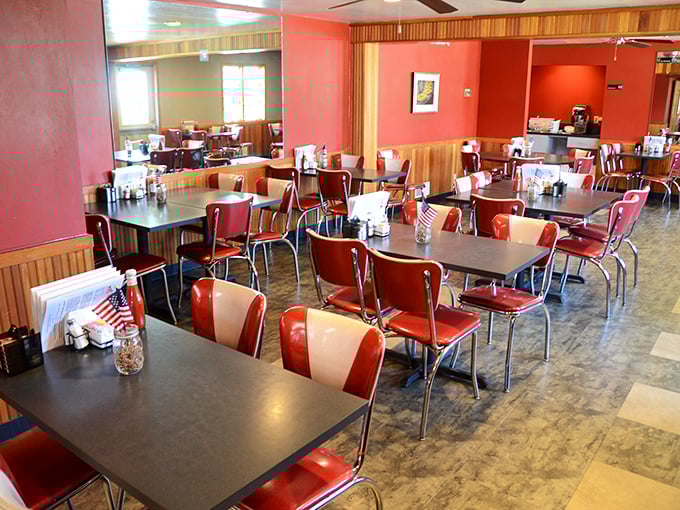Classic diner aesthetics with those unmistakable red vinyl chairs—where comfort food meets comfortable seating in perfect harmony.