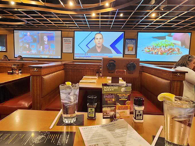 Booth seating that invites you to settle in for the long haul. The multiple screens ensure you won't miss a play while savoring every bite.