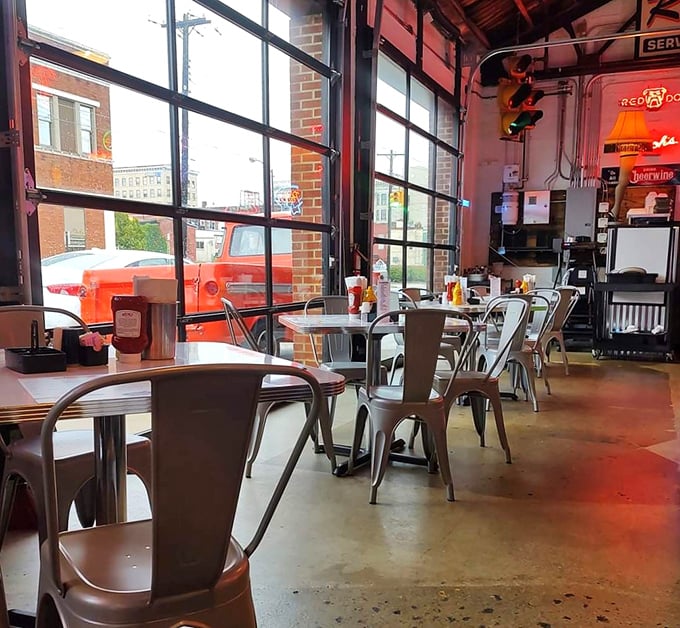 Garage doors, metal chairs, and neon signs create an atmosphere that's part auto shop, part time machine. The perfect backdrop for comfort food conversations.