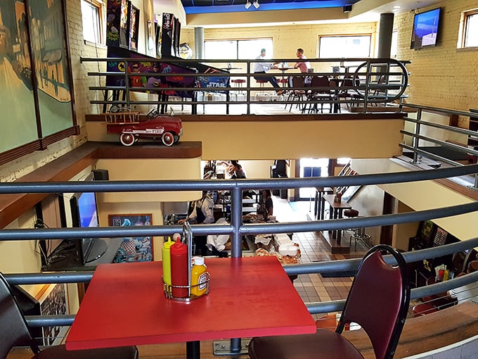 The multi-level dining space combines casual comfort with architectural interest, making every seat in the house feel like the best one.