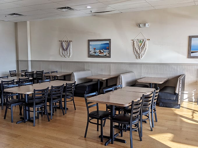 Sunlight streams through windows illuminating booths where breakfast dreams come true. Like Hemingway's clean, well-lighted place, but with pancakes.