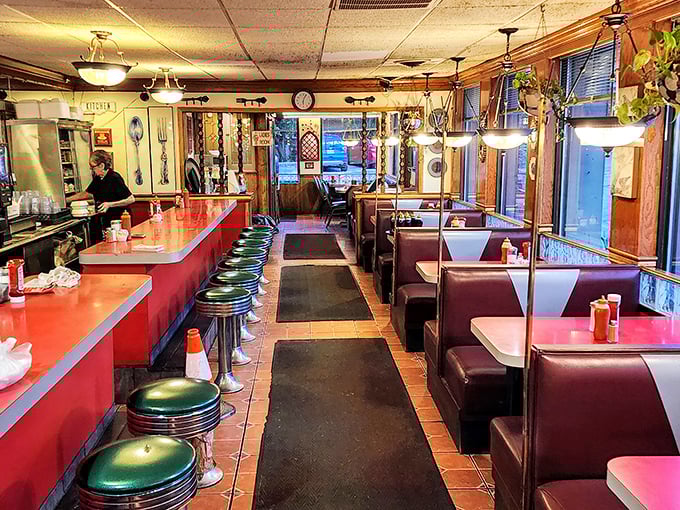 Classic diner design that hasn't changed because it doesn't need to—red counters, green stools, and the promise of comfort food just seconds away.