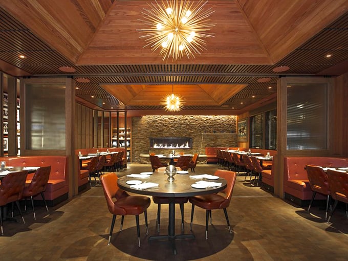 The dining room balances mid-century elegance with California warmth—those starburst chandeliers could have lit Frank Sinatra's dinner parties.