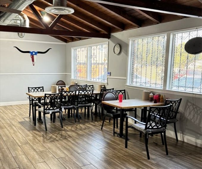 Simple tables, wooden beams, and a longhorn on the wall—Texas isn't just in the name, it's in every inch of this welcoming space.