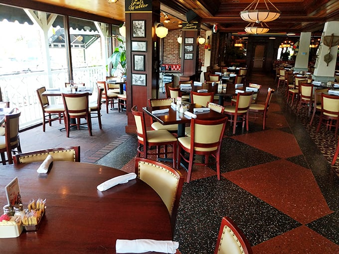 The dining room whispers "stay awhile" with its checkerboard floors and comfortable seating—like your fancy friend's house, but with better food.