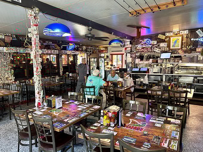 The dining room feels like it's been collecting memories for decades—every sticker, sign, and dollar bill adding to the story.