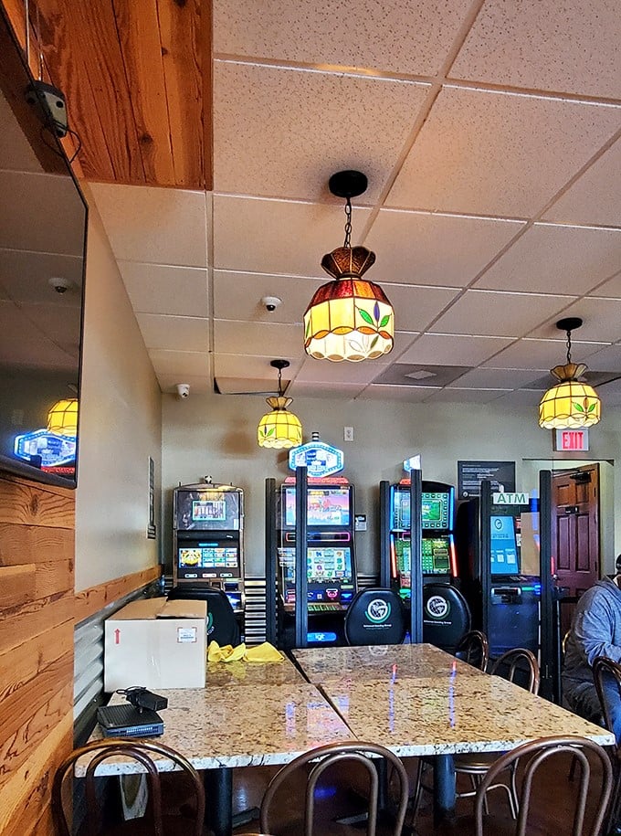 Stained glass pendant lights cast a warm glow over the gaming area—because nothing complements an Italian beef like trying your luck at video poker.