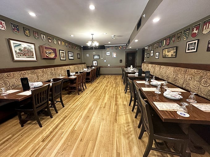 The dining room balances elegance with comfort, where European crests watch over tables that have hosted countless celebrations and everyday meals alike.