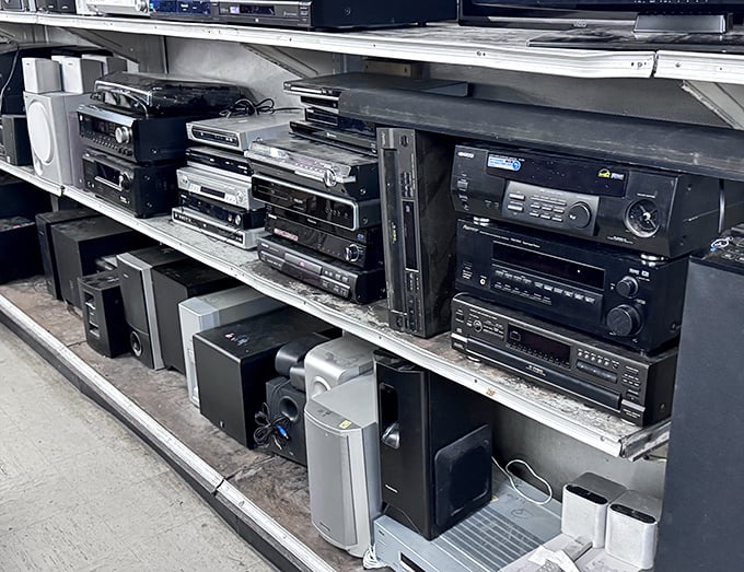 The electronics graveyard where yesterday's cutting-edge technology finds new purpose. That stereo receiver? It's vintage now, not just old.