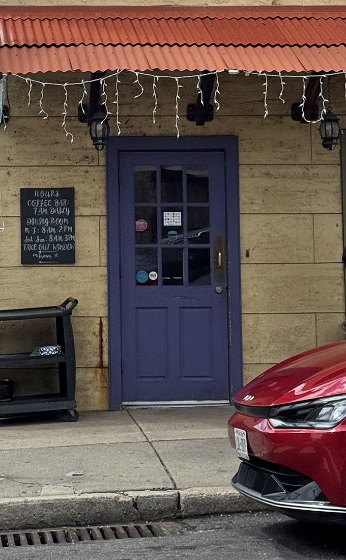 The blue door entrance says "come as you are" while the string lights whisper "but something magical happens inside."