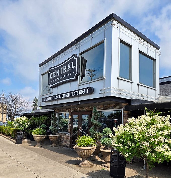 The daytime view reveals thoughtful landscaping and welcoming entrance. Like meeting someone who's even more charming in daylight than they were last night.