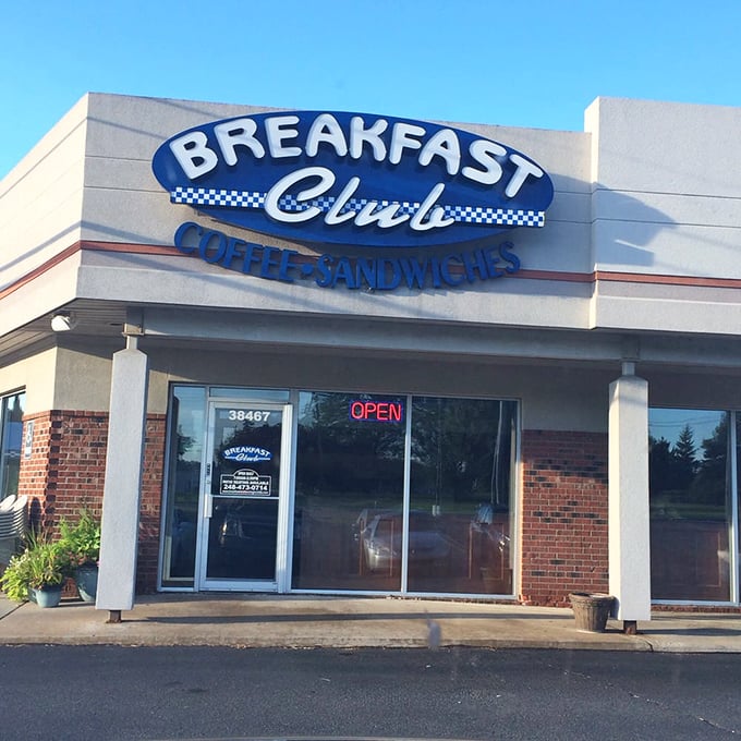 The "OPEN" sign glows like a beacon of hope for the hungry. Those hours—7 to 2—mark the sweet spot of breakfast possibility.