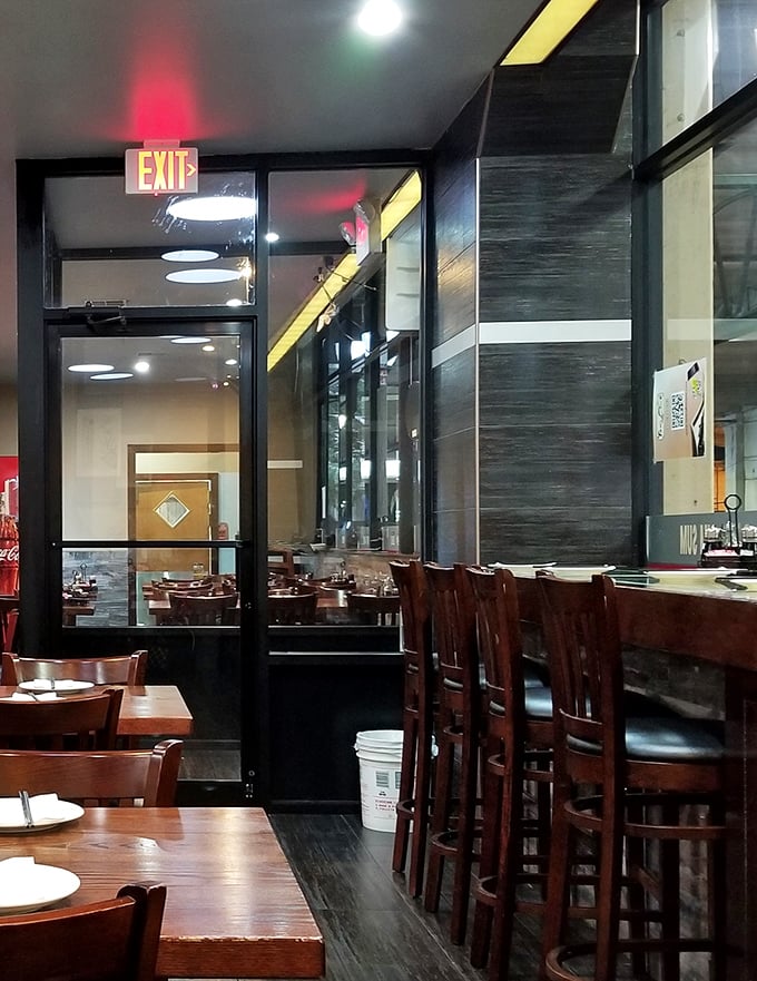 The dining room's clean lines and wooden accents create an atmosphere where the food remains the undisputed star of the show.