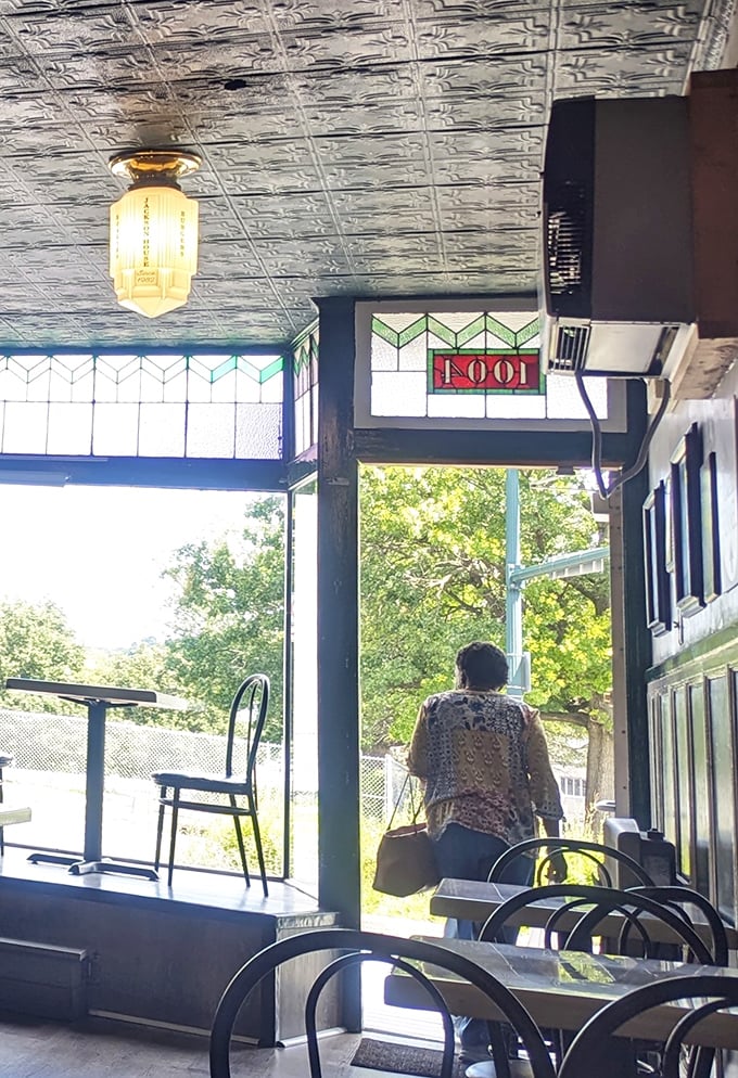 The vintage stained glass and pressed tin ceiling transport you to a simpler time when lunch was an event, not just a pit stop.