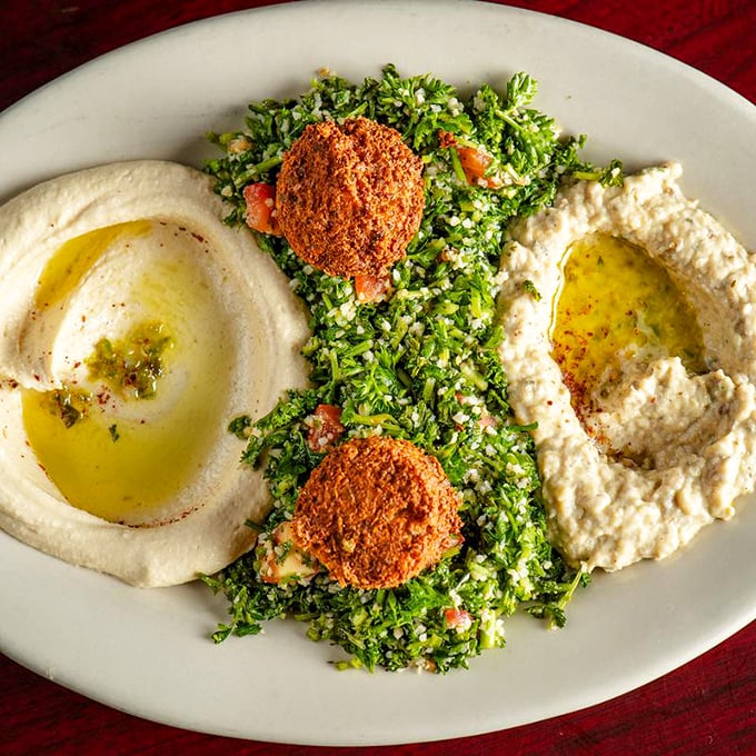Falafel and tabbouleh with twin pools of hummus—a plate so vibrant it practically needs sunglasses, and flavors that make you forget meat ever existed.