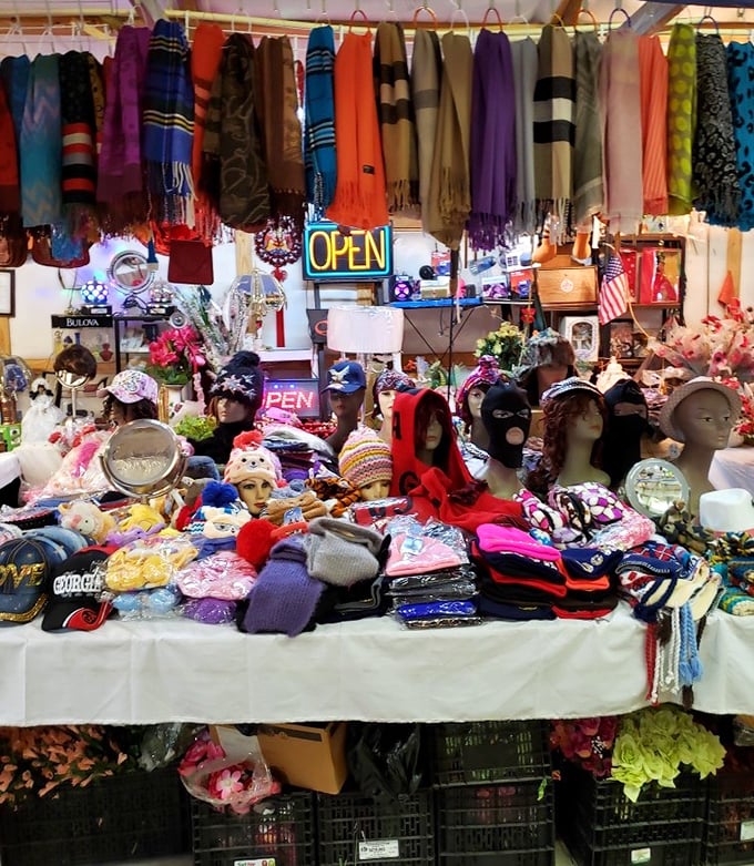 A kaleidoscope of colorful scarves and hats awaits new owners. This vibrant display could transform your wardrobe from "Who's that?" to "Who's THAT?!" in one purchase.