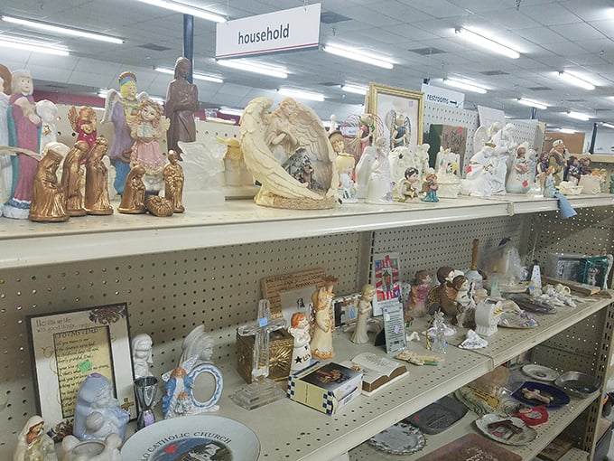 Religious figurines standing guard over household treasures. One person's decluttered mantel becomes another's sacred space.