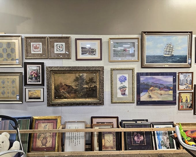 The wall of art ranges from "genuine masterpiece" to "so-bad-it's-good." That ship painting might have hung in a sea captain's study—or your uncle's basement bar.