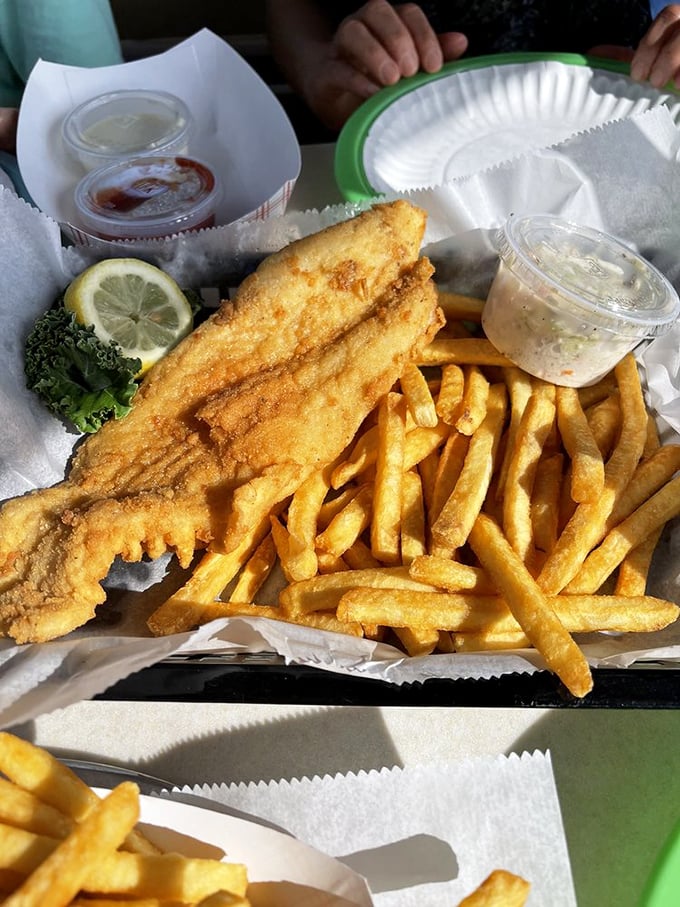 Fried fish that's crispy outside, flaky inside – the kind that makes you wonder why you ever bother with fancy restaurants when this exists.