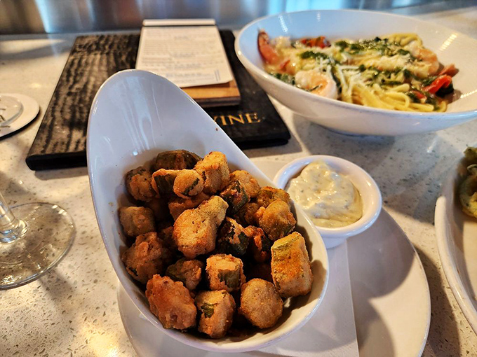Crispy fried okra that proves vegetables can be just as indulgent as dessert—the perfect southern sidekick to your seafood feast.